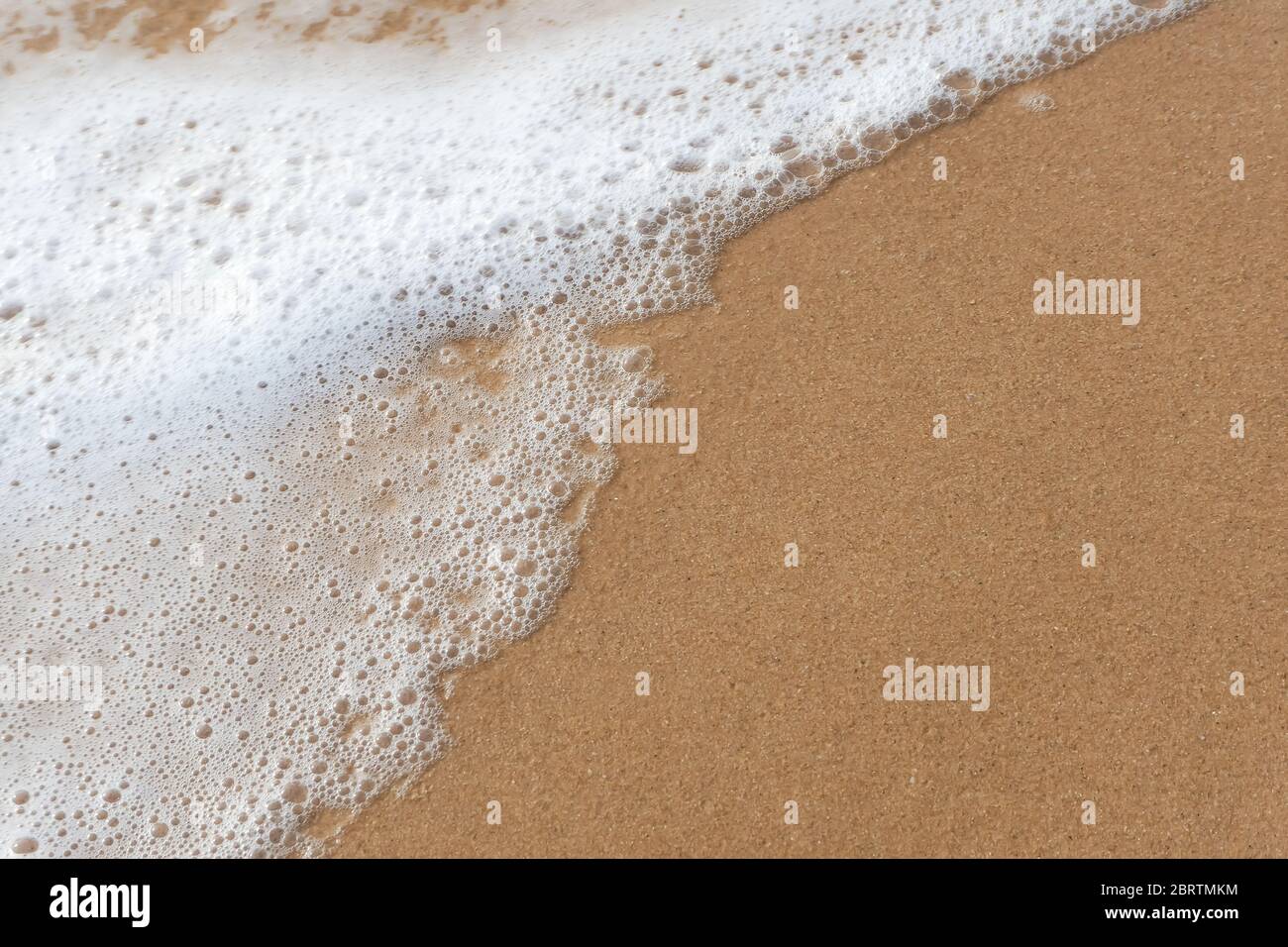 Bubble of Sea wave on the beach Stock Photo - Alamy