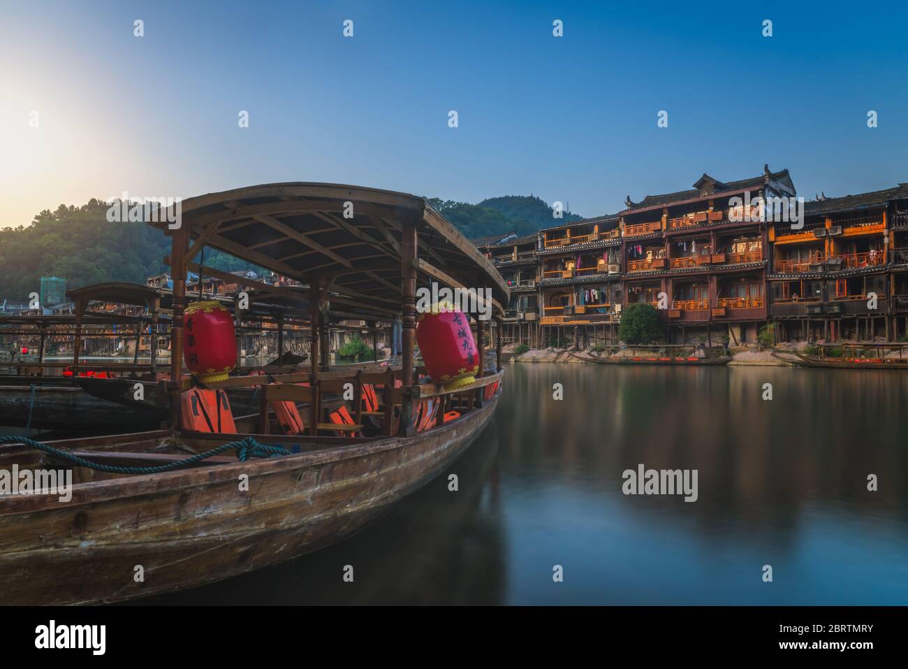 Feng Huang, China - August 2019 : Old historic wooden tourist boats ...