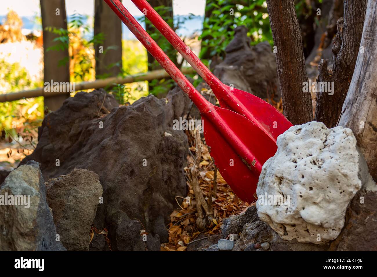 Two red oars as detail of ancient boat as decoration. Outside asian ...