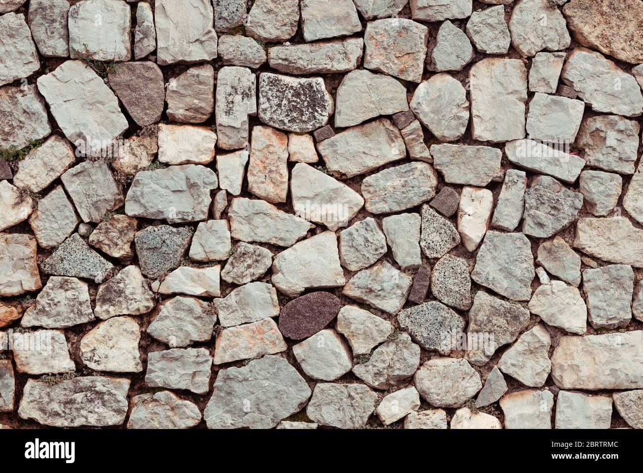 Rustic vintage wall of uneven marble granite porphyry stones italian ...