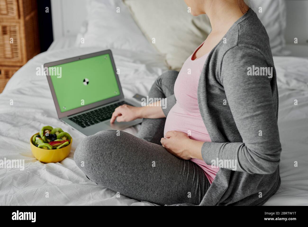 Horizontal picture of computer used by pregnant woman Stock Photo - Alamy