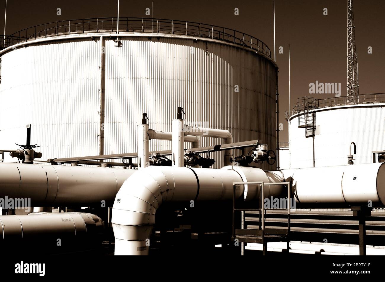 Crude oil tank in the oil refinery. Storage tanks for oil. Tanks for ...