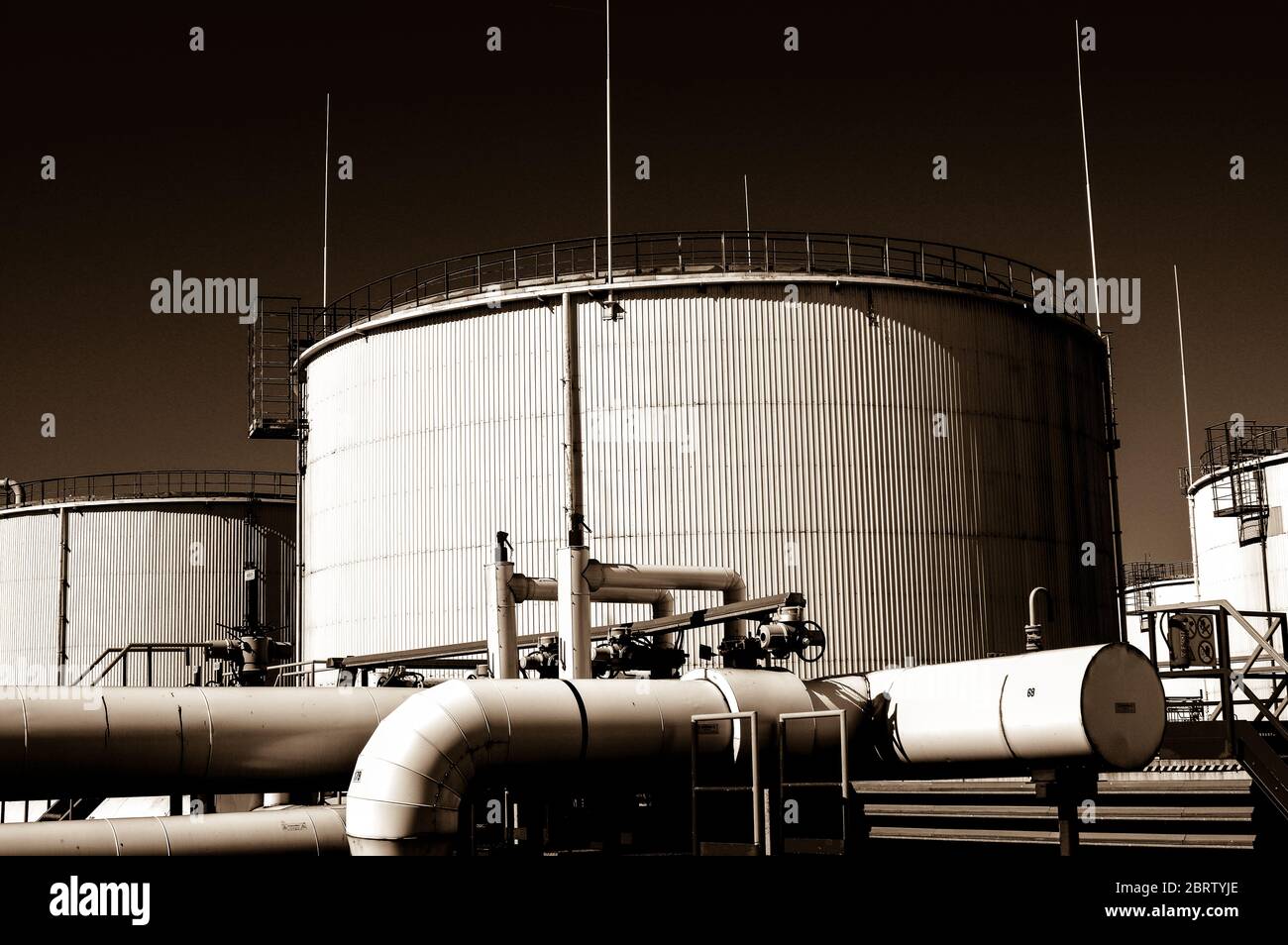 Crude oil tank in the oil refinery. Storage tanks for oil. Tanks for ...