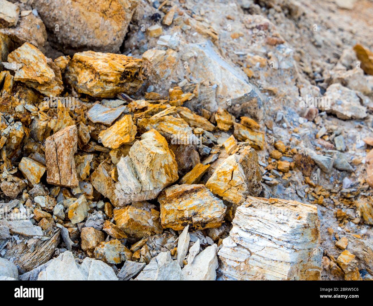 Hard rock yellow soil hi-res stock photography and images - Alamy