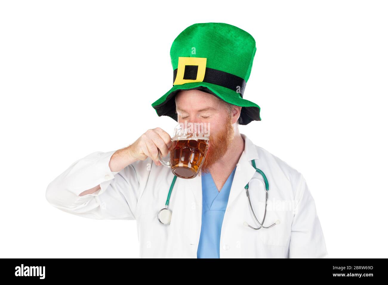 Redhead doctor with green hat drinking a beer isolated on a white ...