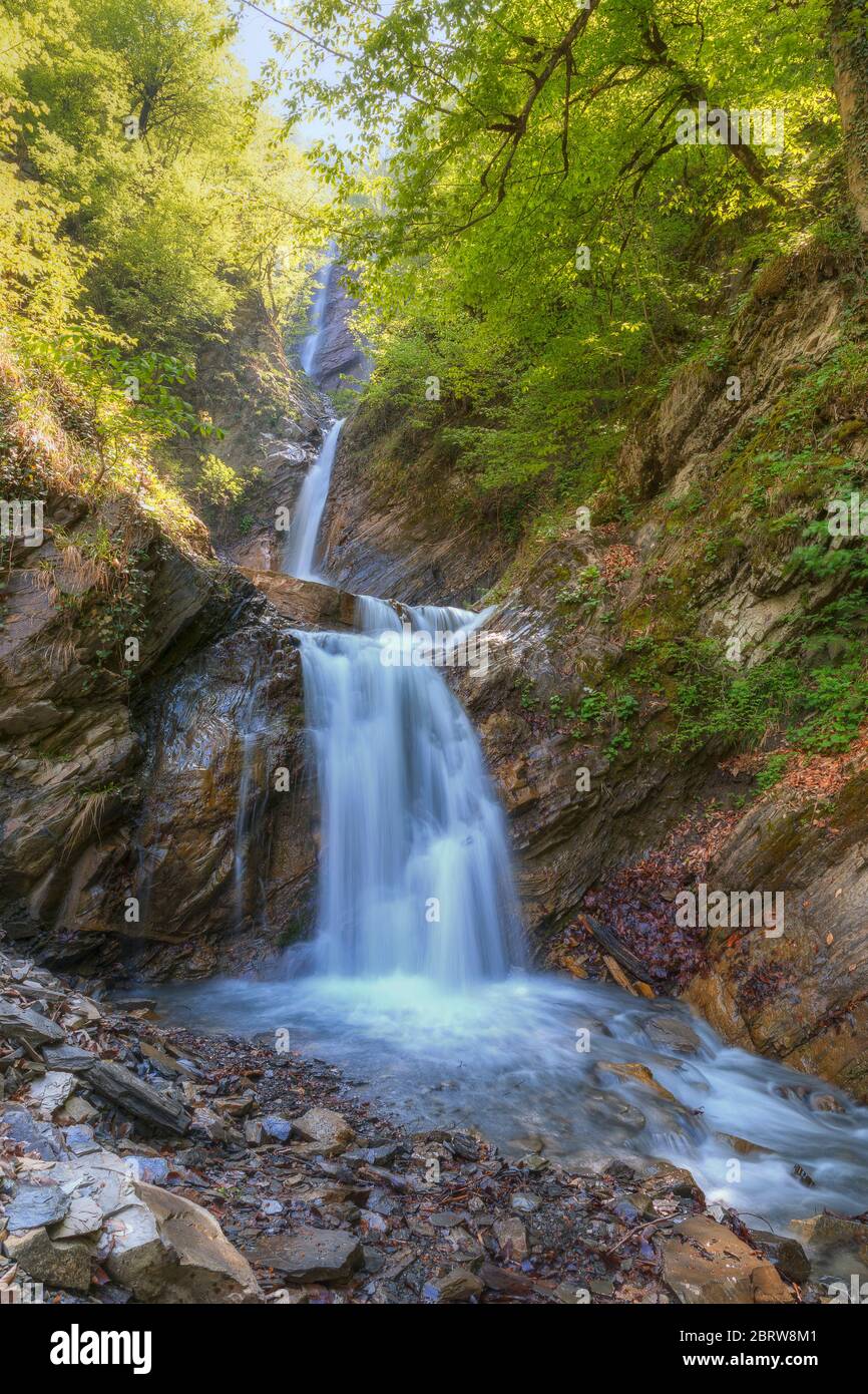 Three-stage waterfall in the spring in the mountains Stock Photo - Alamy