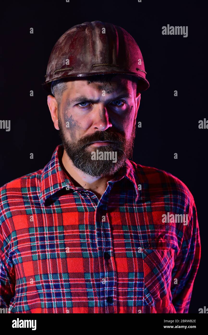 Man with strict face expression isolated on black background. Worker ...