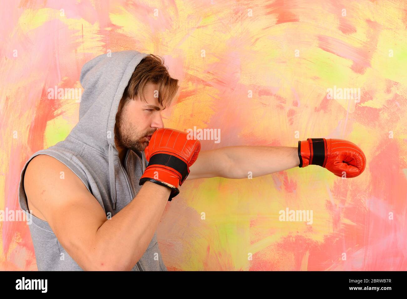 Boxer with concentrated face trains and makes punch. Sports and fight ...
