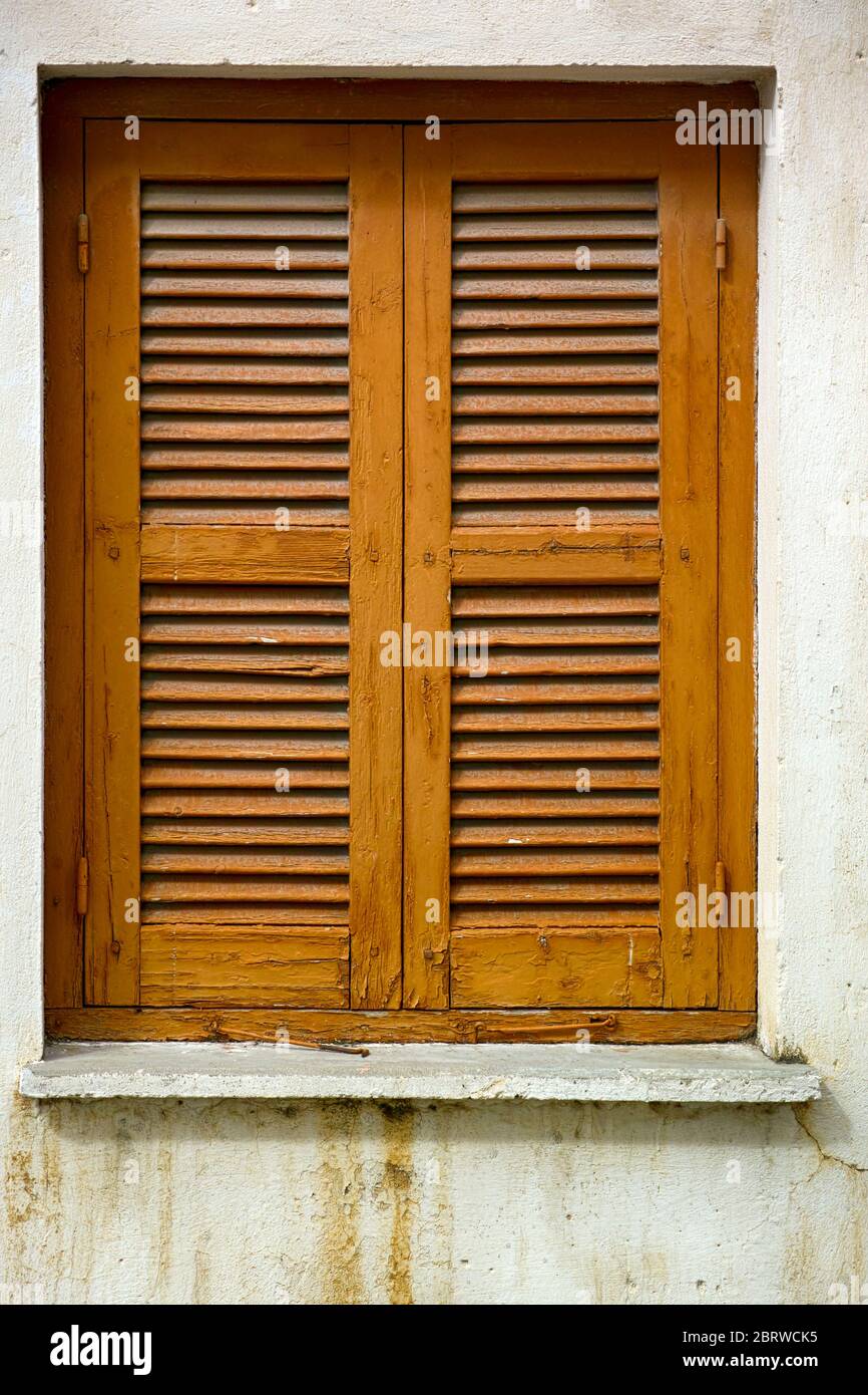 Window with closed wooden shutters. Close-up Stock Photo - Alamy