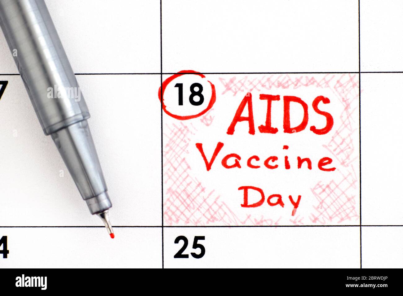 Reminder AIDS Vaccine Day in calendar with pen. May 18 Stock Photo - Alamy