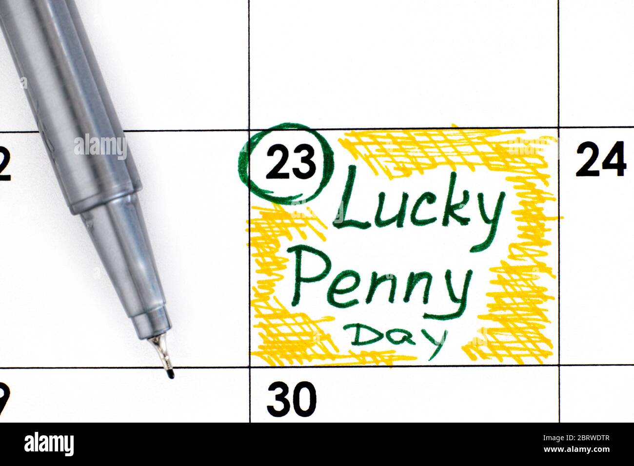 Reminder Lucky Penny Day in calendar with pen. May 23 Stock Photo - Alamy