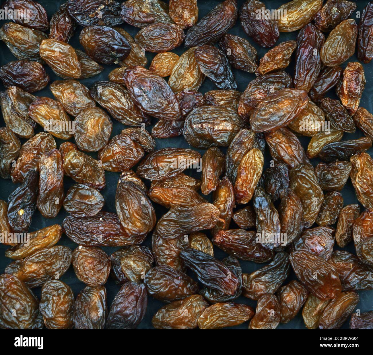 Organic sun dried raisins. For texture or background Stock Photo - Alamy