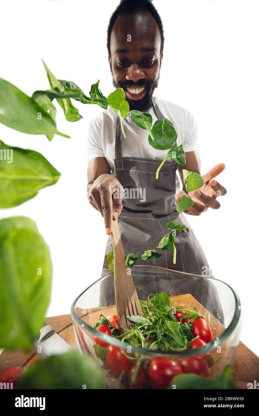 Amazing african-american man preparing unbelievable food with action ...