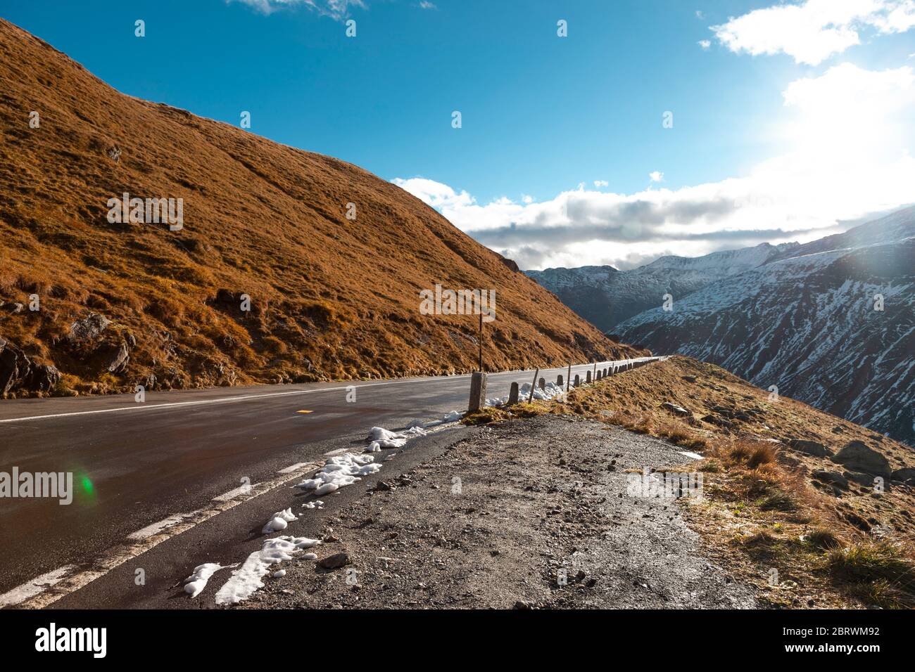 Road winding through the mountains Stock Photo - Alamy