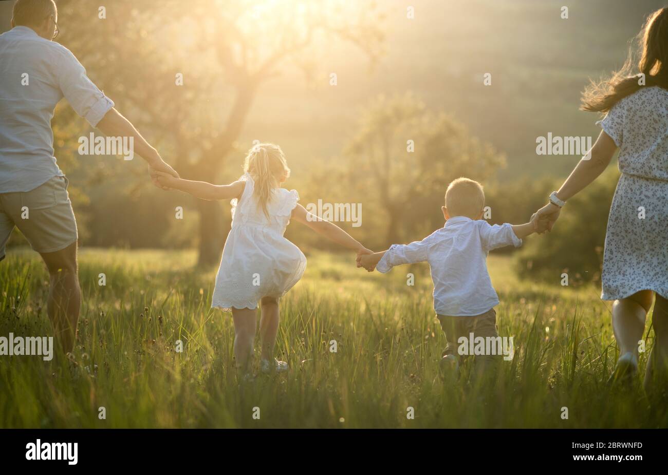 Woman children boy girl rear view hi-res stock photography and images ...