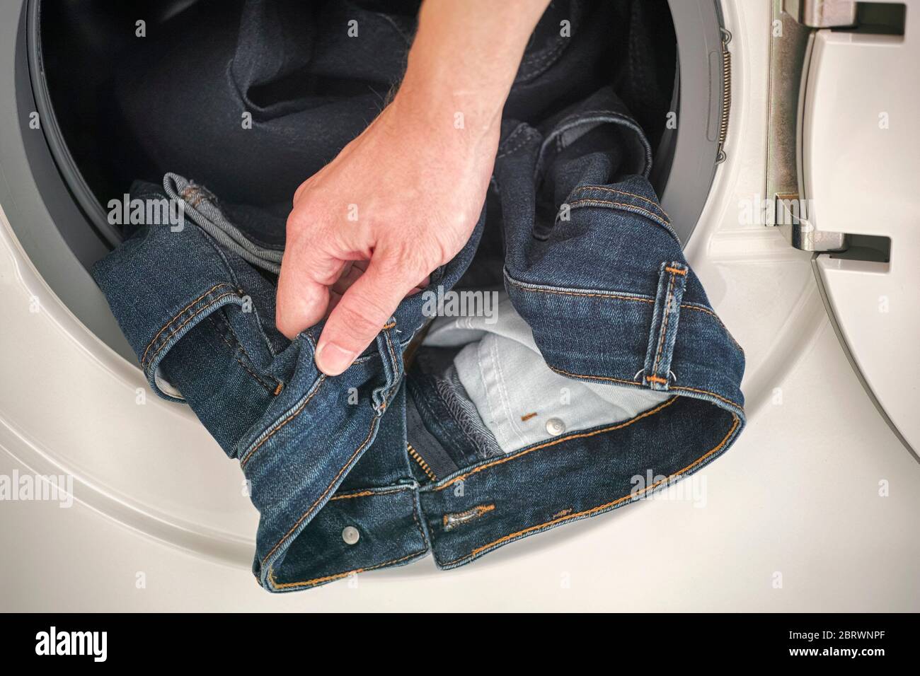 Man washing clothes by hand hi-res stock photography and images - Alamy