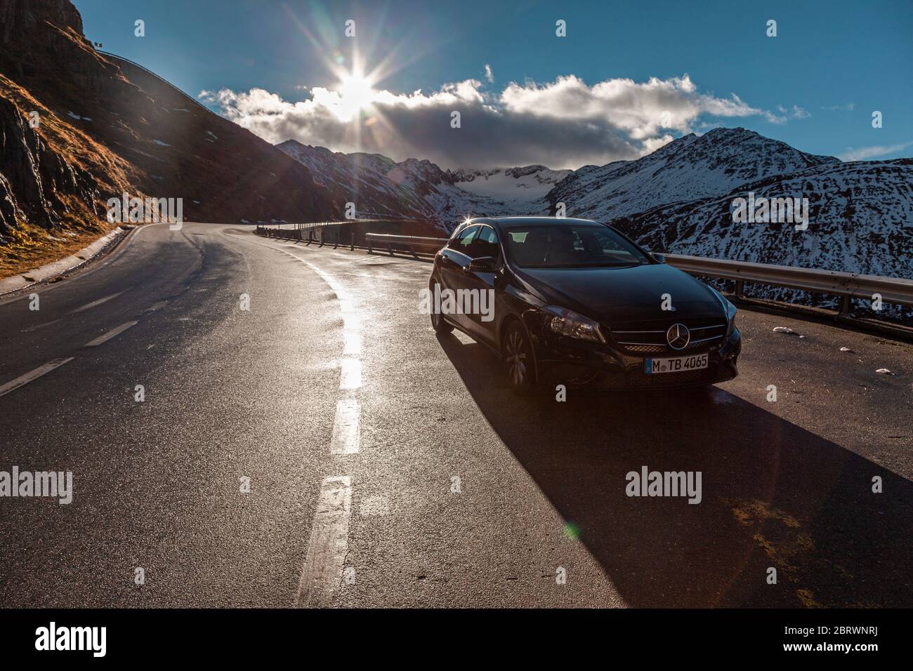 Car driving on mountain roads Stock Photo - Alamy