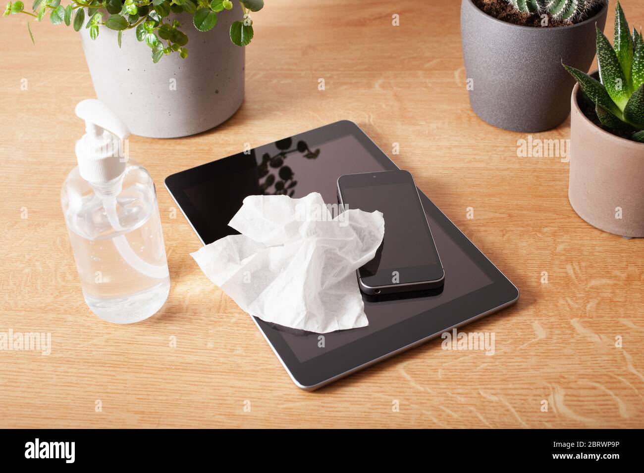disinfecting tablet computer and smartphone screen, eliminating germs ...
