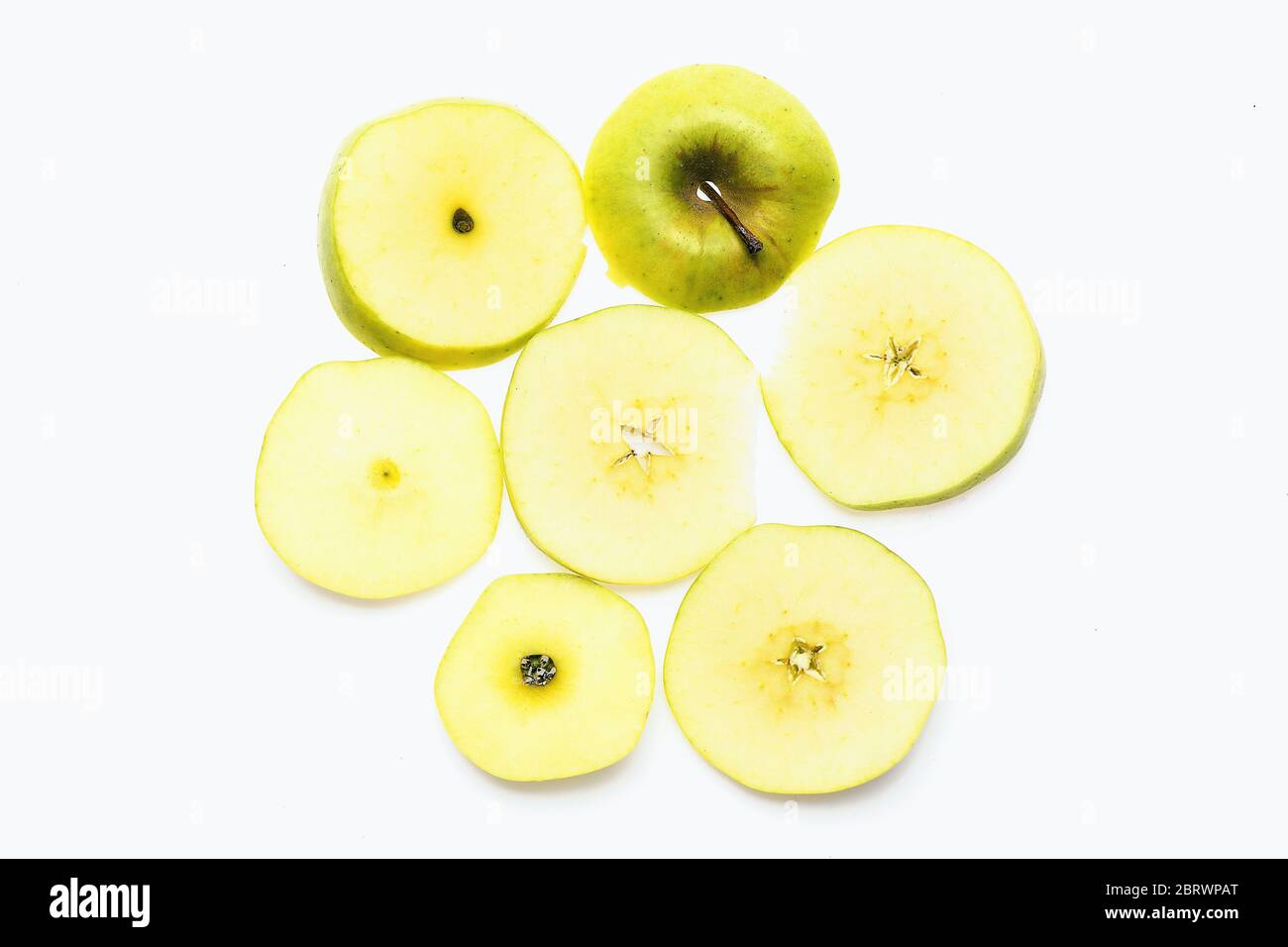 Apple cut into seven pieces: separate slices of green apple placed in a ...