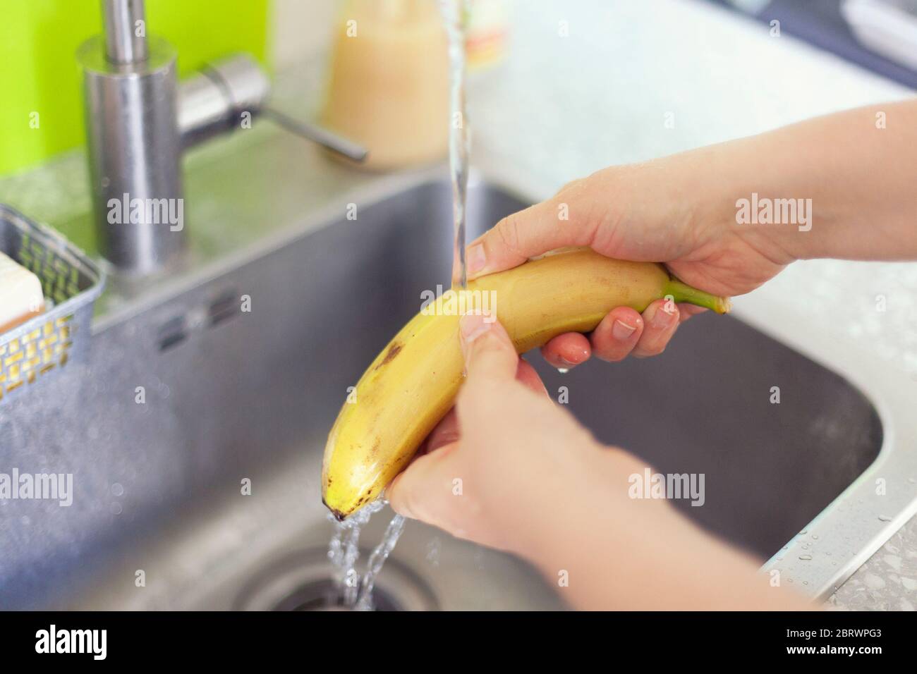 Hand washing fruit High Resolution Stock Photography and Images - Alamy