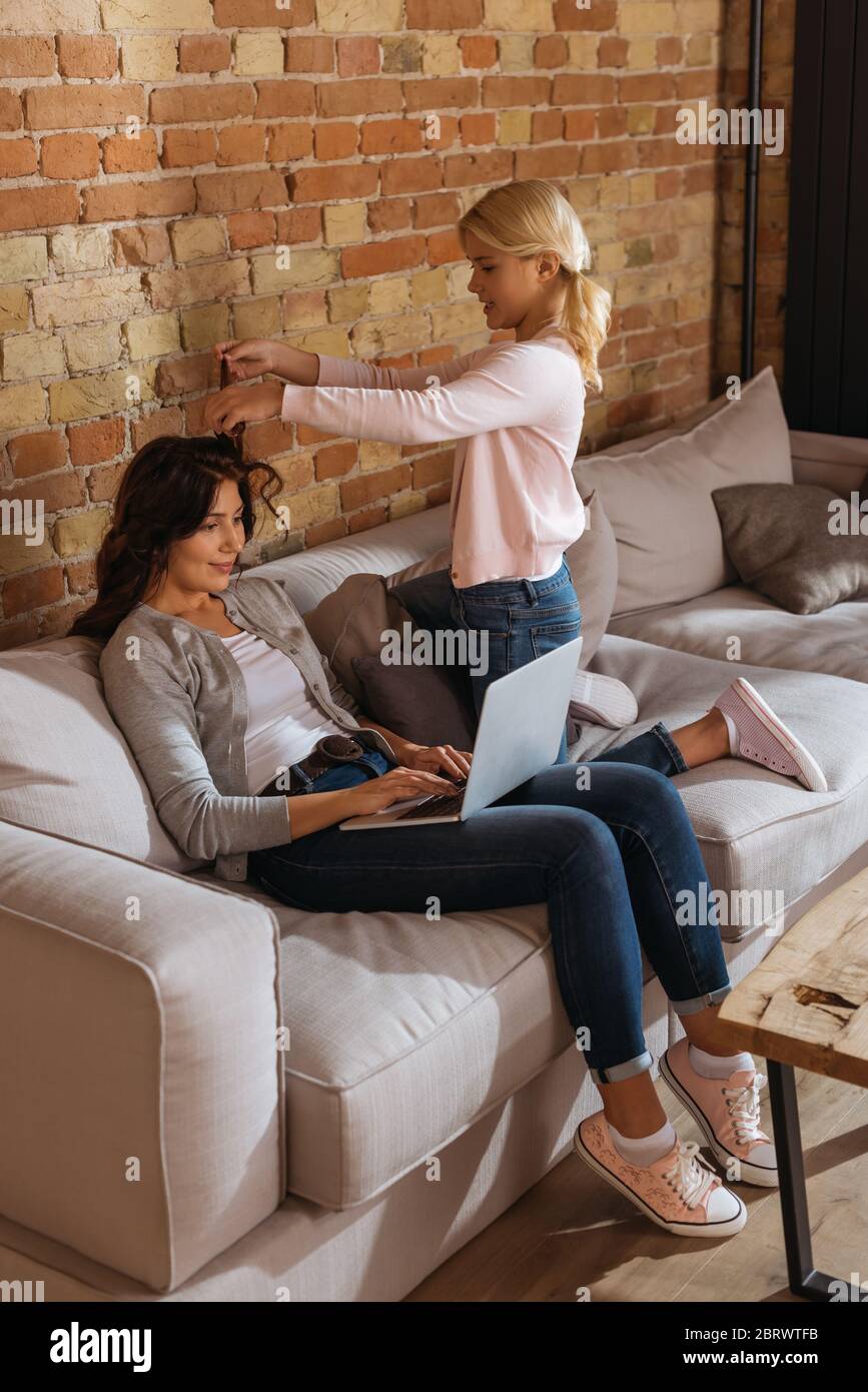 Kid touching hair hi-res stock photography and images - Alamy