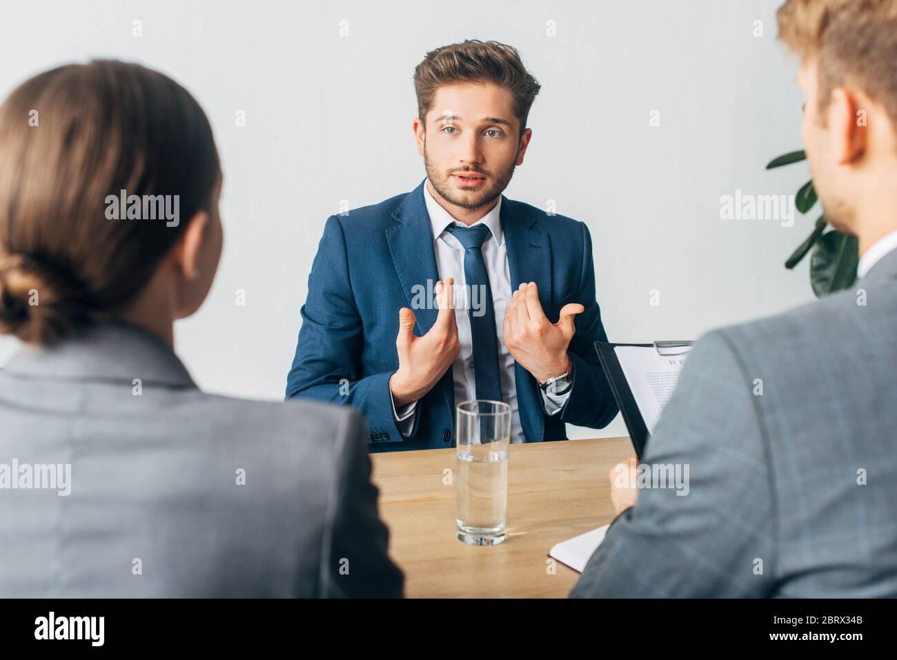 Selective focus of employee pointing on oneself during job interview ...