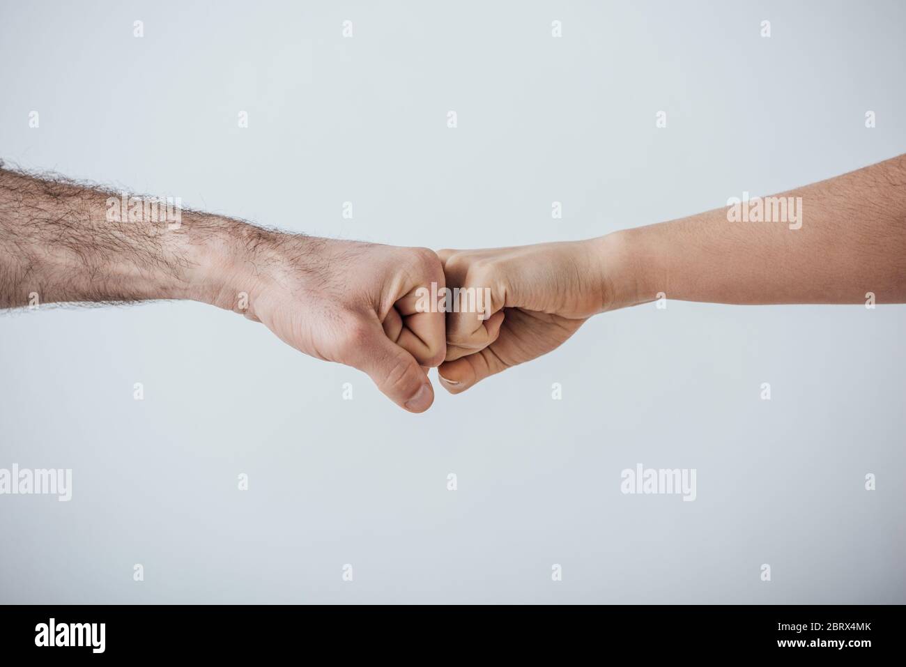 Two hands doing fist bump hi-res stock photography and images - Alamy
