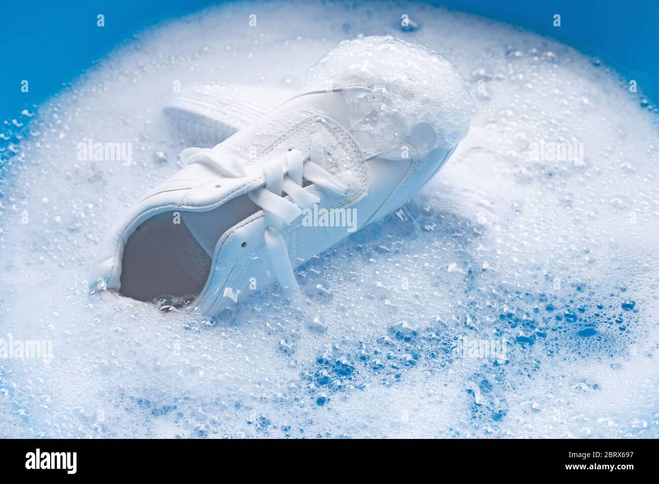 Soak shoes before washing. Cleaning Dirty sneakers Stock Photo - Alamy