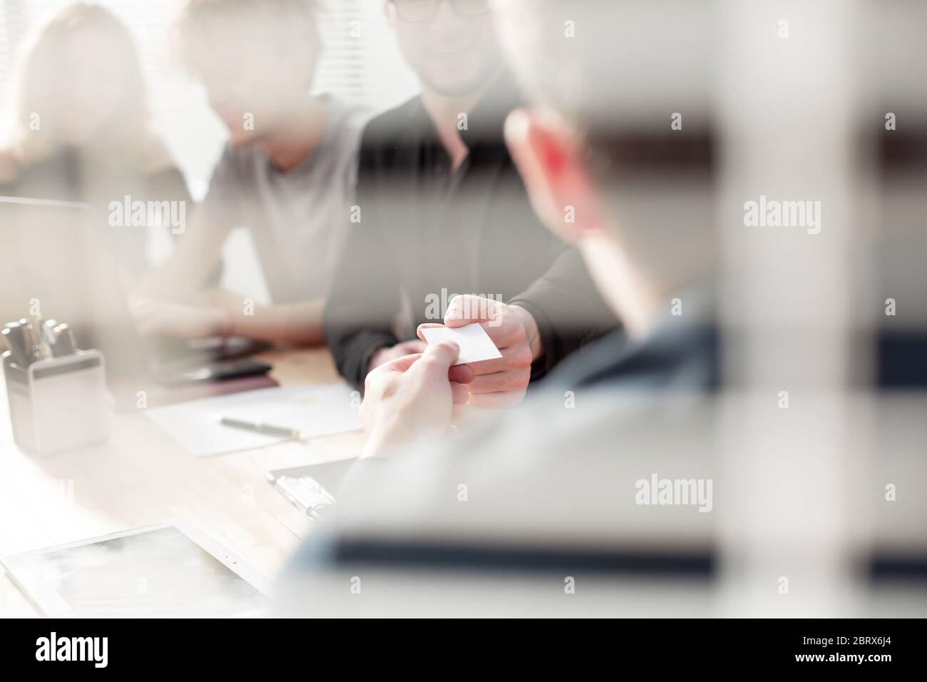 Group Of Designers Meeting Around Table In Modern Office Stock Photo ...