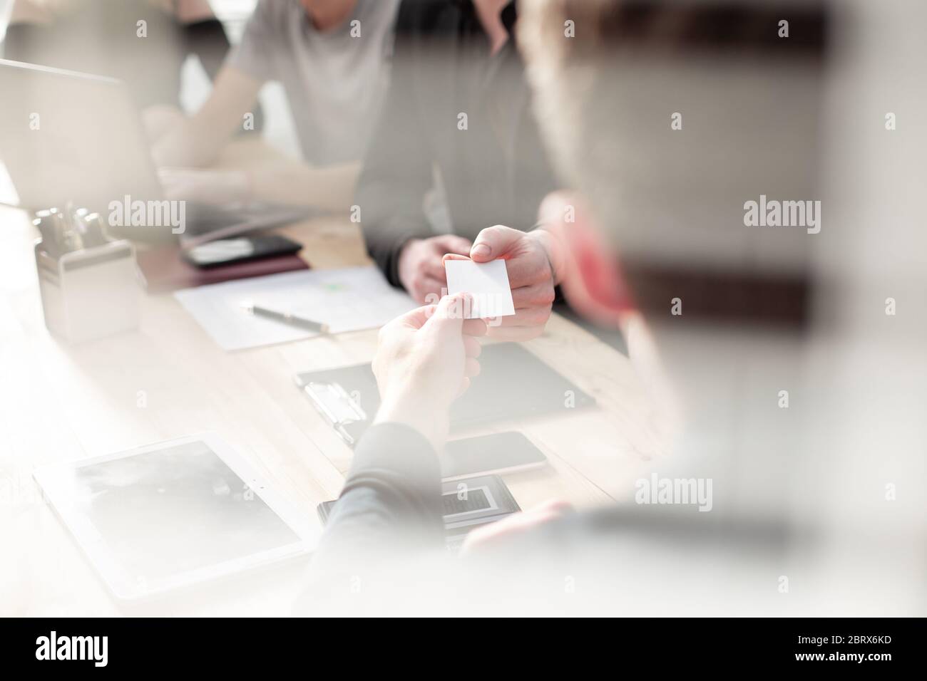 Group Of Designers Meeting Around Table In Modern Office Stock Photo ...
