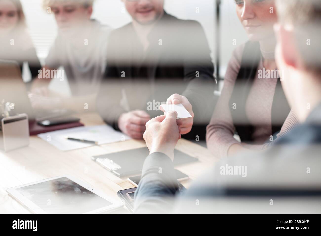 Group Of Designers Meeting Around Table In Modern Office Stock Photo ...