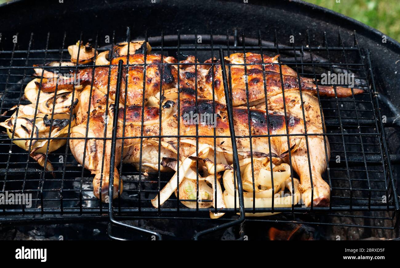 Grilled chicken on the grill Stock Photo - Alamy