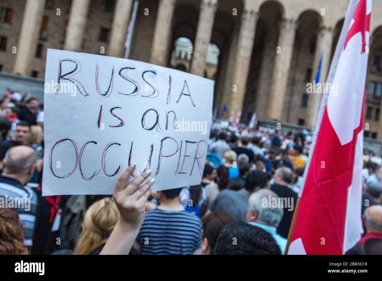 Tbilisi, Georgia - June 20, 2019: Georgian girl holding a poster ...