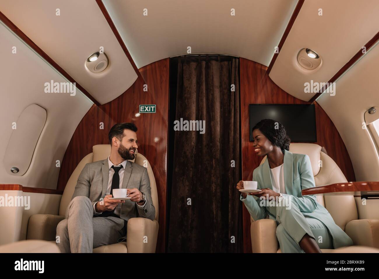 Businessman woman talking plane hi-res stock photography and images - Alamy