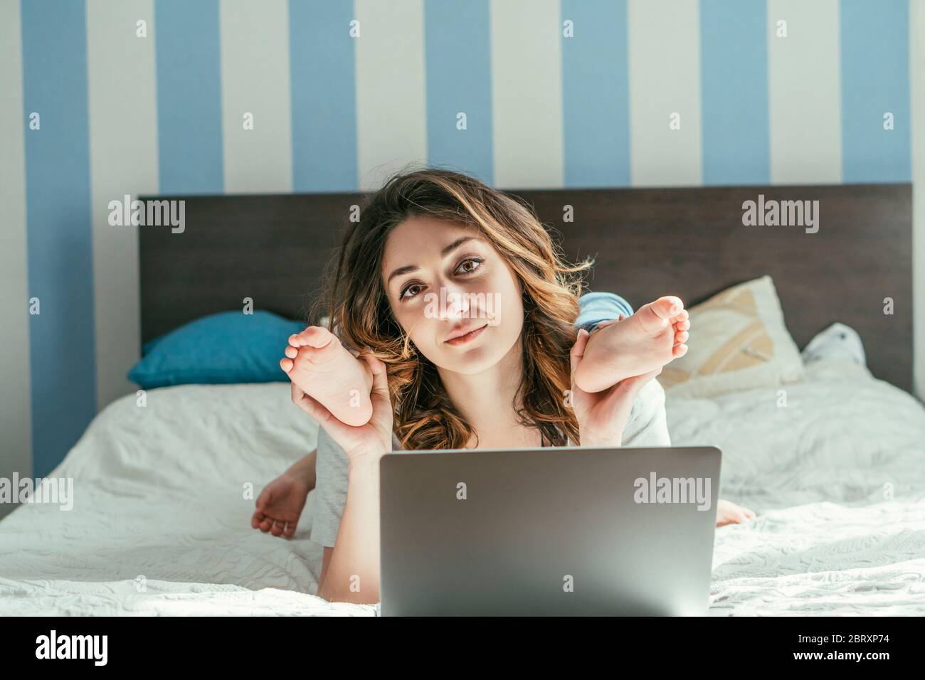 Boy touching legs hi-res stock photography and images - Alamy