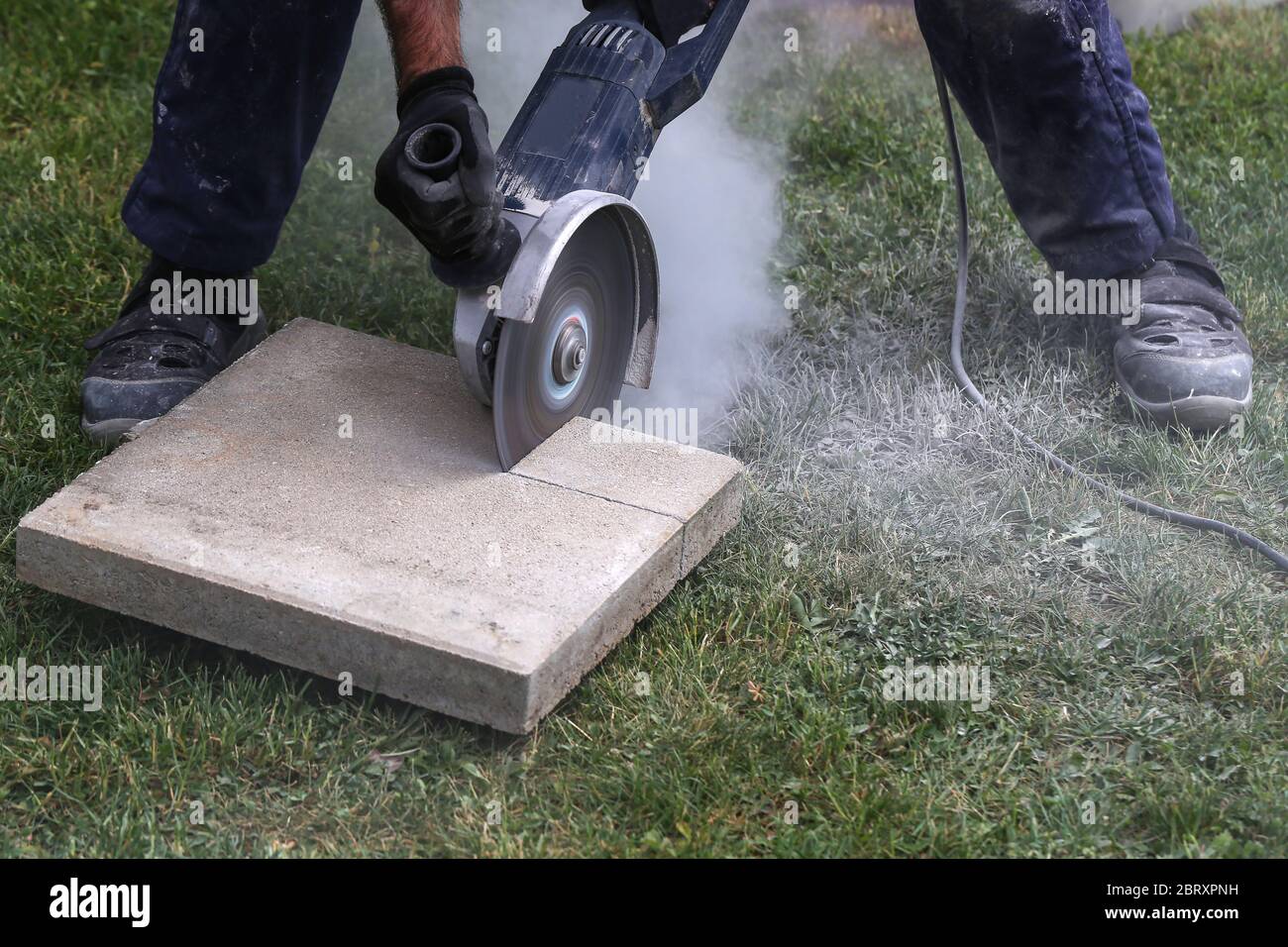 Industrial construction worker using a professional angle grinder Stock ...
