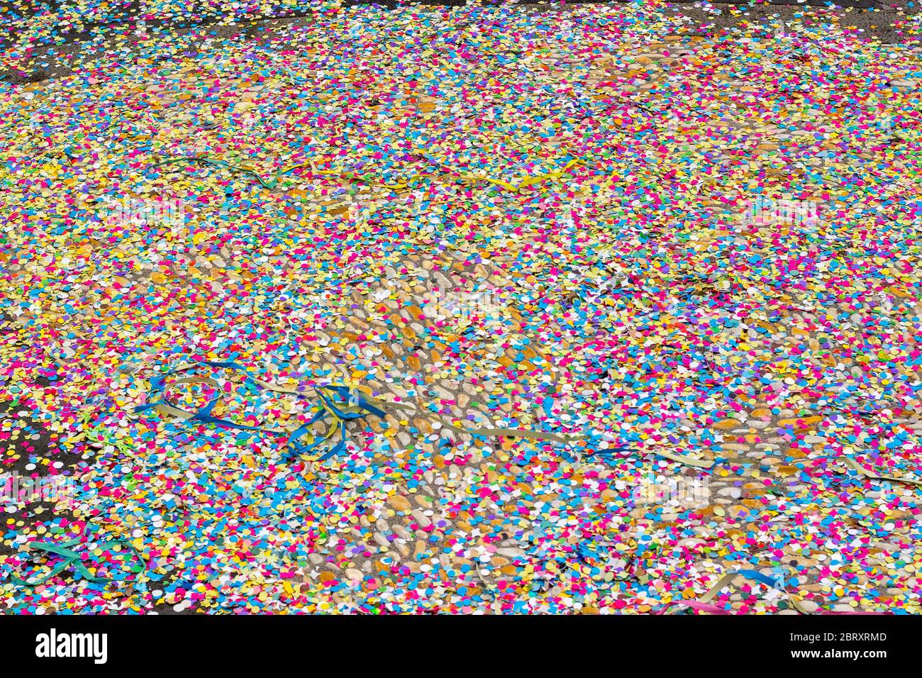 confetti carpet on the pavement during the carnival Stock Photo - Alamy