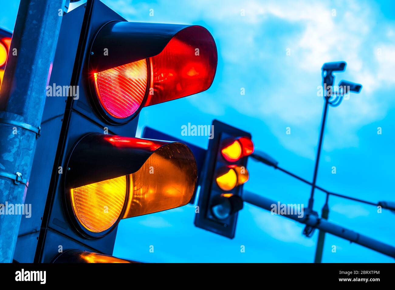 Traffic lights over urban intersection Stock Photo - Alamy
