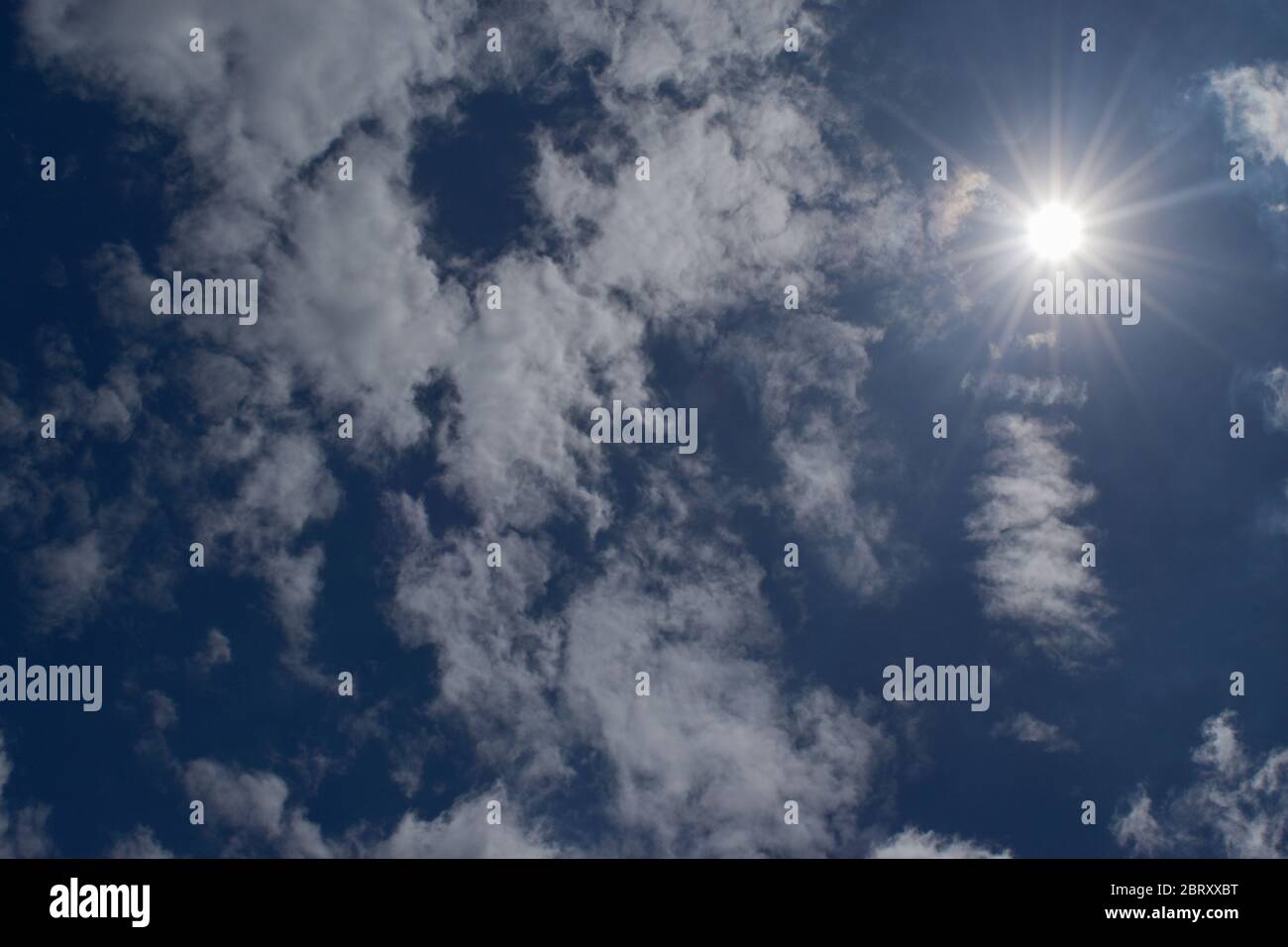 Day sky with bright sunshine. Blue sky with clouds and sun Stock Photo ...