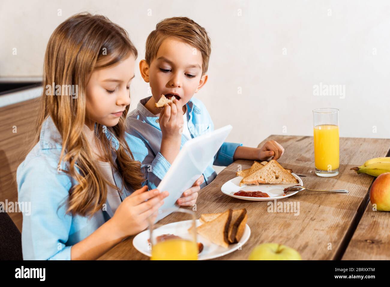 collage of siblings e-learning and eating breakfast at home Stock Photo ...