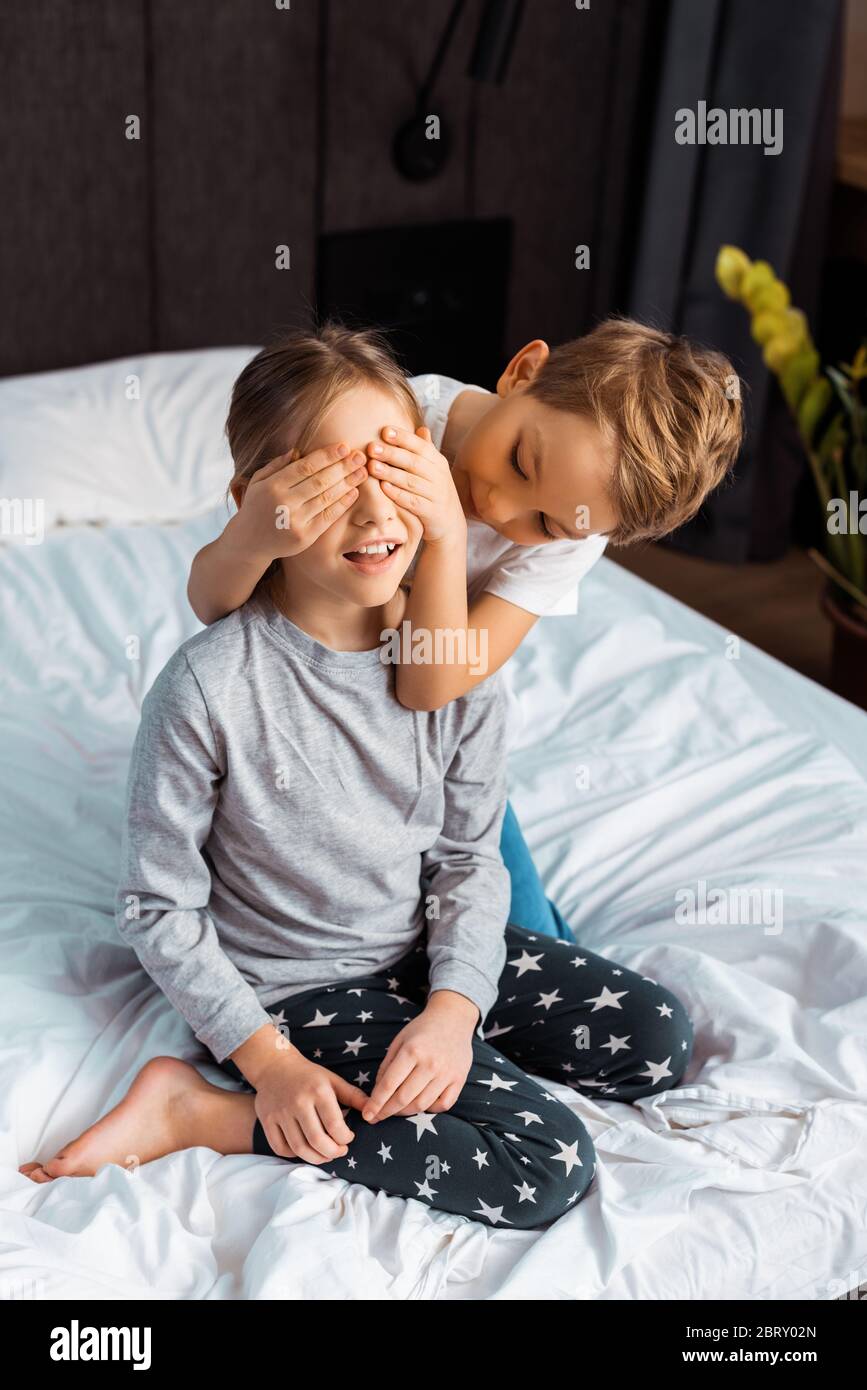 Preteen boy covering eyes hi-res stock photography and images - Alamy