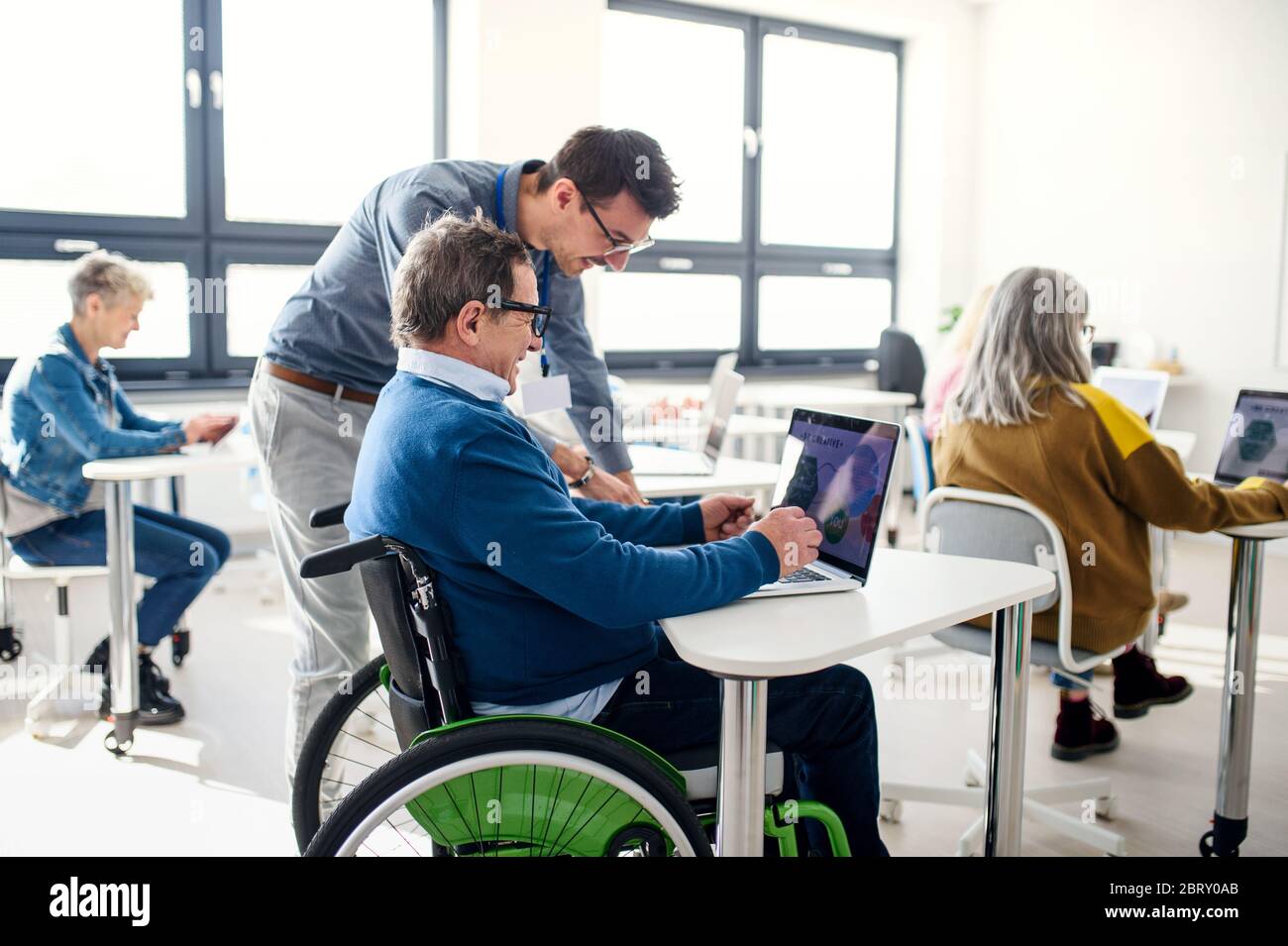 Wheelchair student in classroom hi-res stock photography and images - Alamy