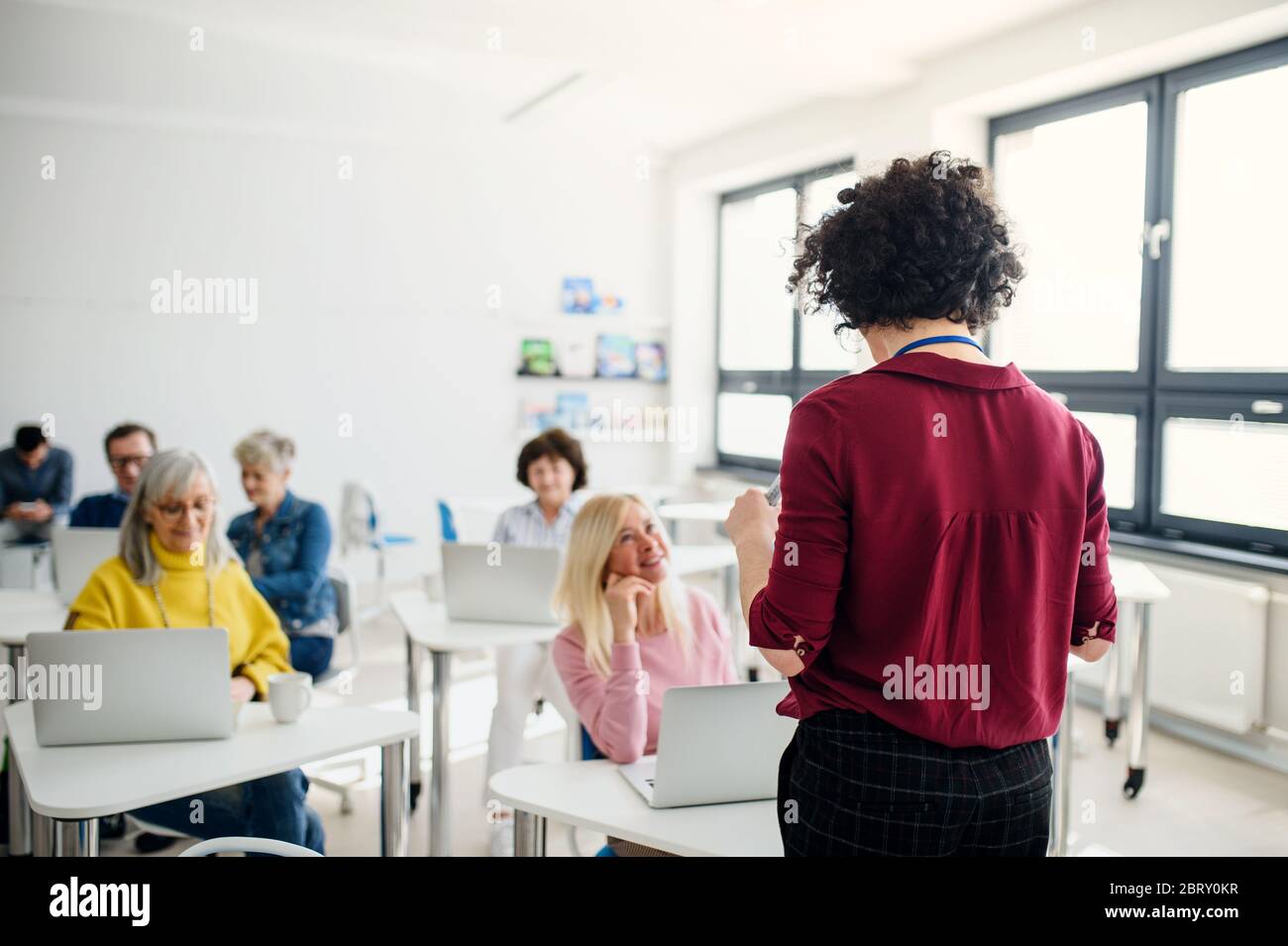 Group of senior people attending computer and technology education ...