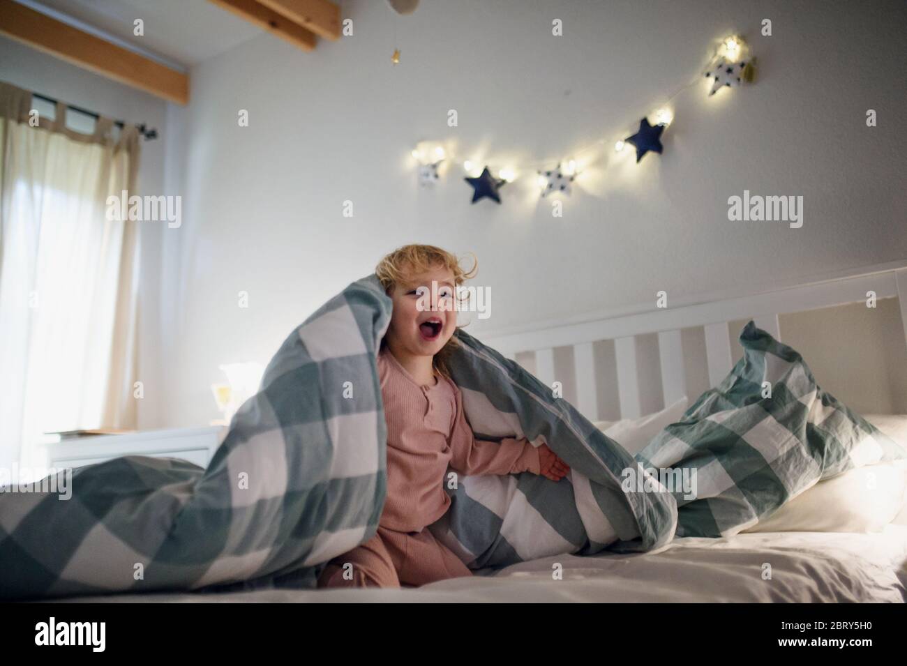 Girl hiding kids hi-res stock photography and images - Alamy