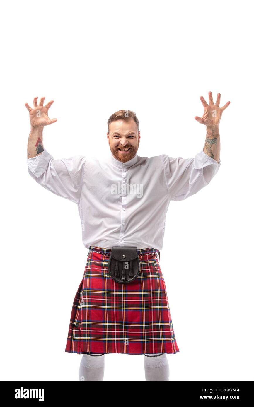 Scottish redhead man in red kilt scaring isolated on white Stock Photo ...