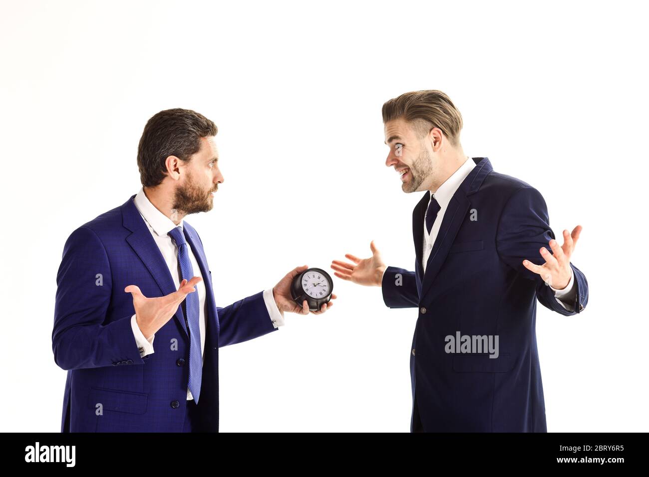 Manager discipline young office worker for being late, point to clock ...