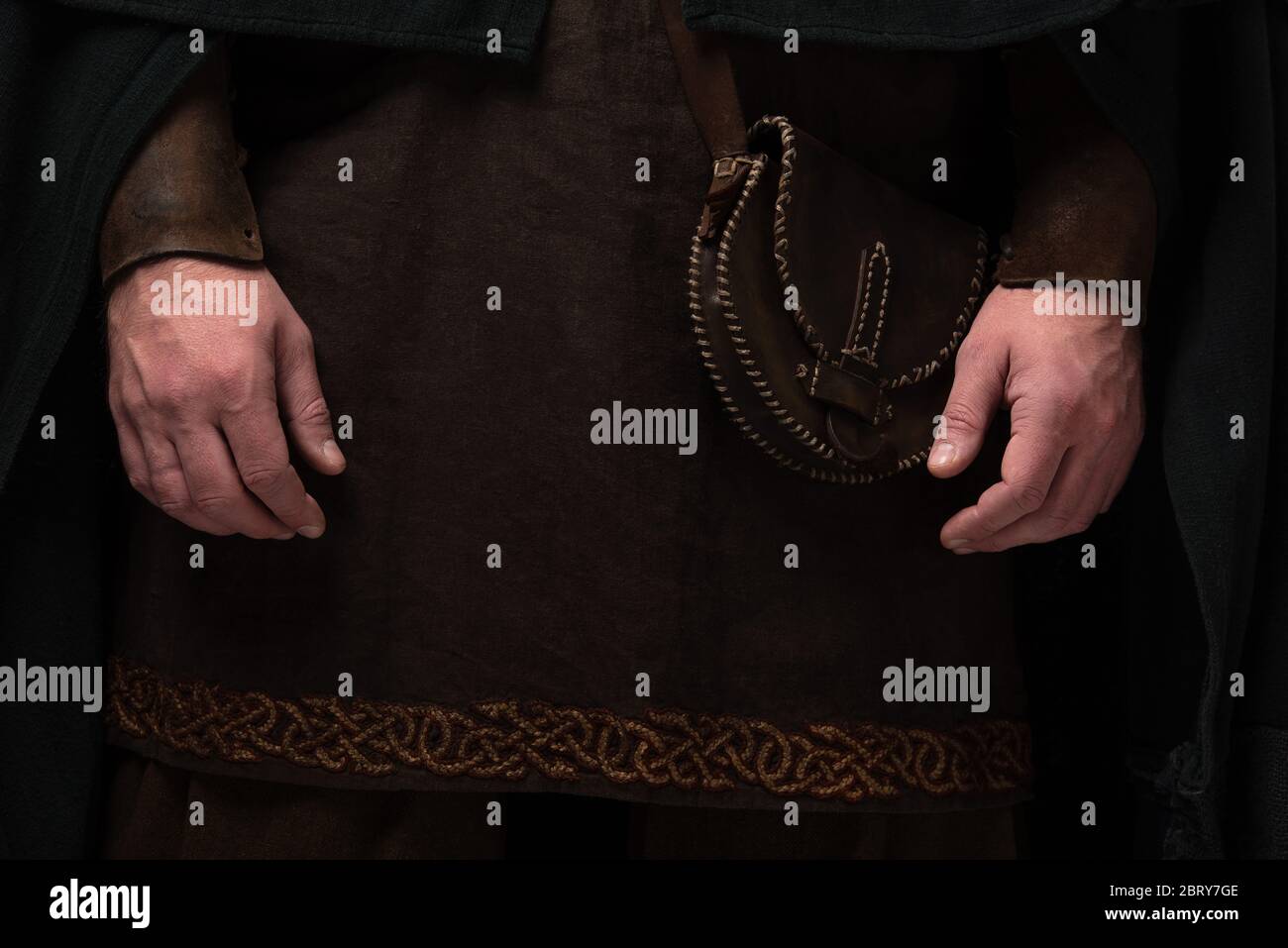 close up view of medieval Scottish man in mantel with leather bag Stock ...