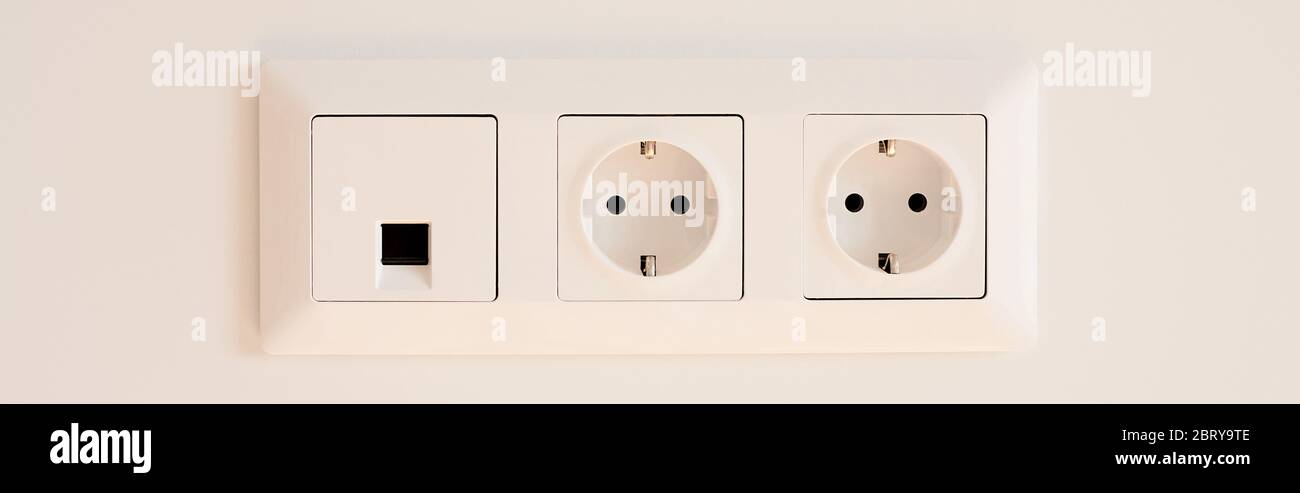 panoramic orientation of switch near power sockets on white Stock Photo ...