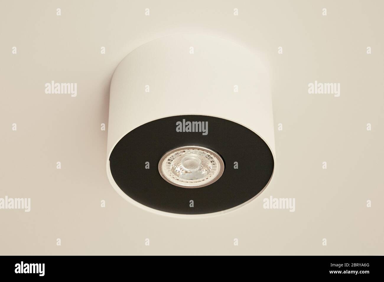 halogen bulb in lamp on white ceiling in apartment Stock Photo - Alamy