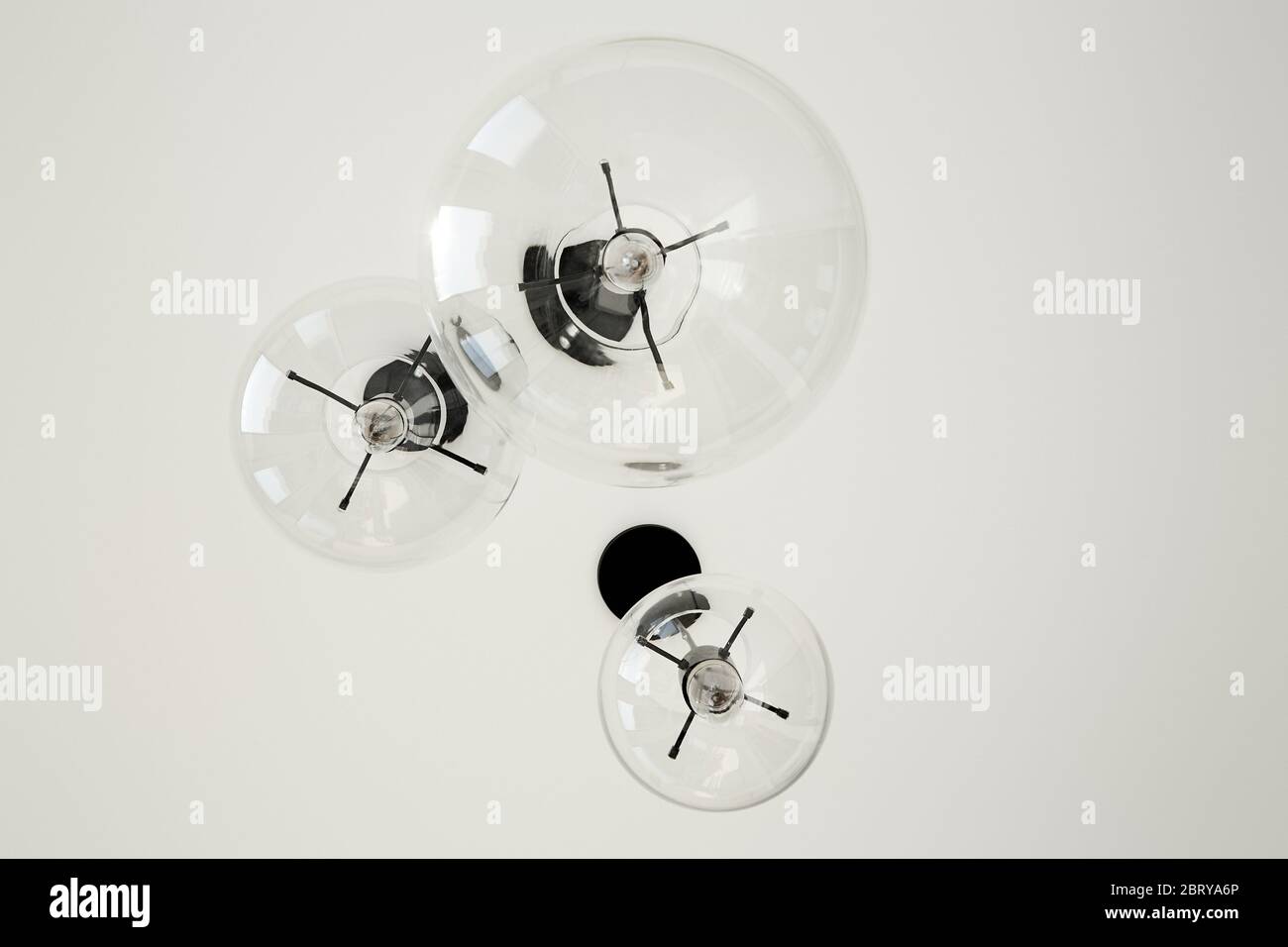 bottom view of light bulbs on ceiling Stock Photo - Alamy